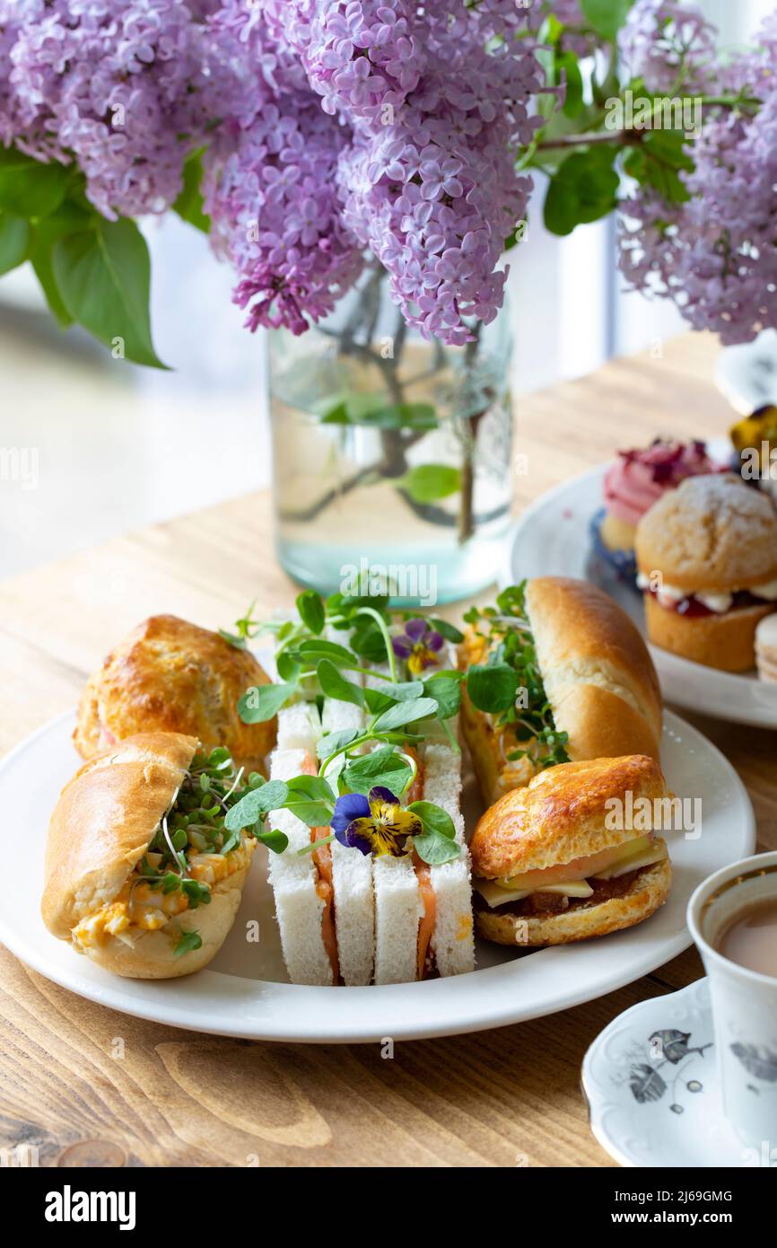 Traditional english afternoon tea with selection of cakes and ...