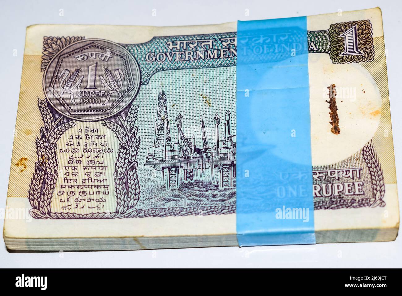 Old One Rupee notes combined on the table, India money on the rotating ...