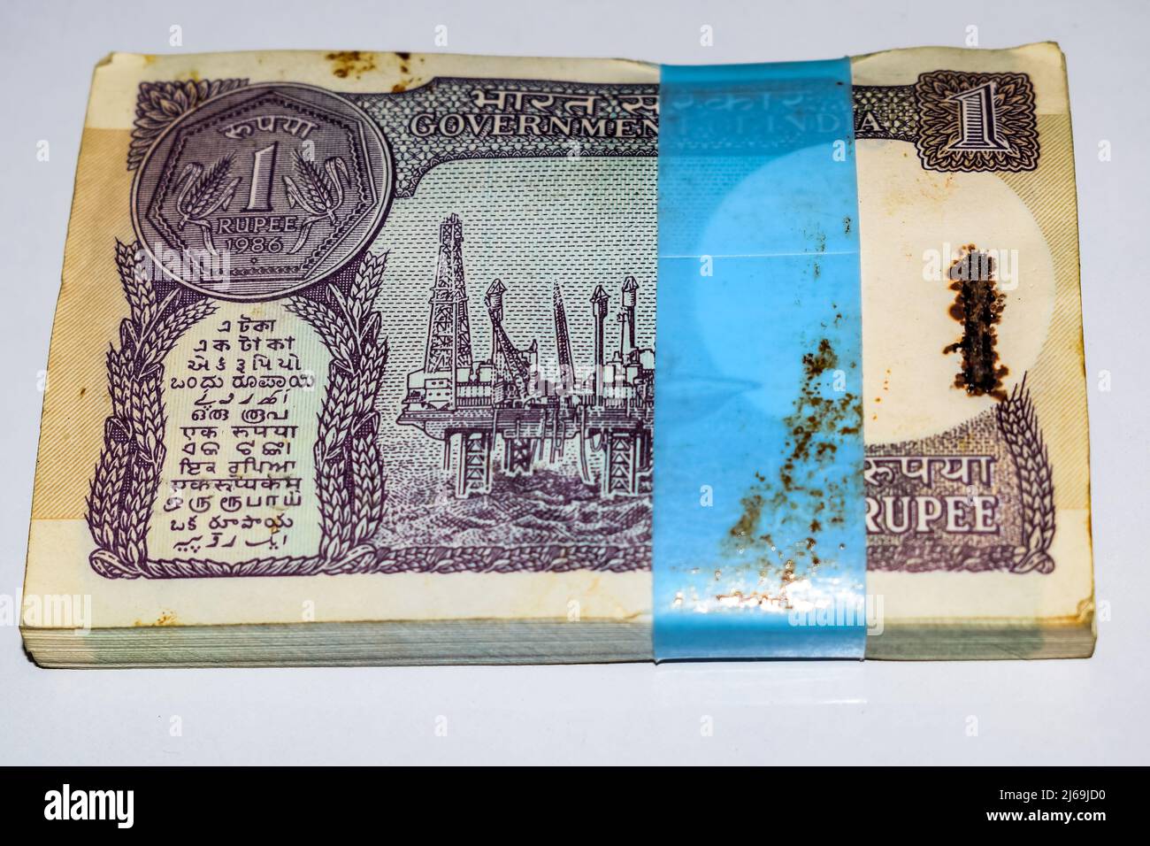Old One Rupee notes combined on the table, India money on the rotating ...