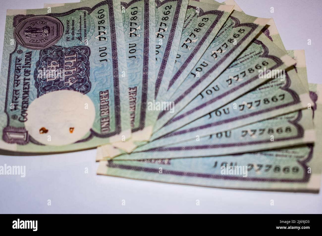 Old One Rupee notes combined on the table, India money on the rotating ...