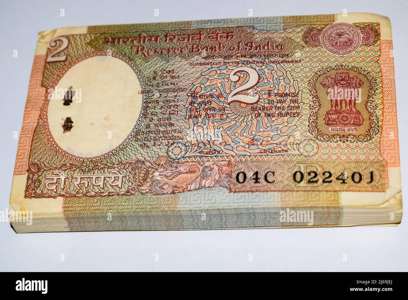 Old Two Rupee notes combined on the table, India money on the rotating ...
