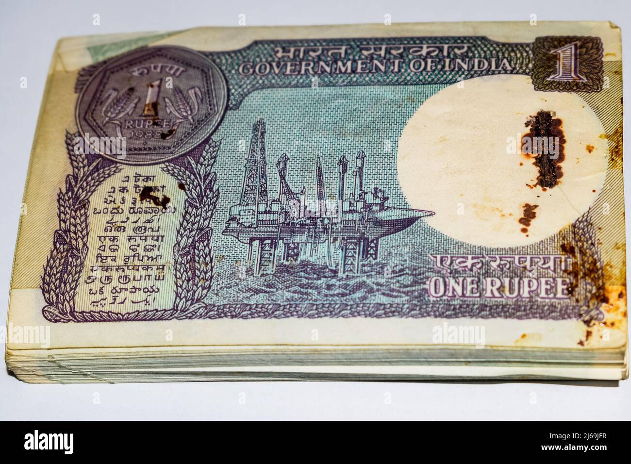Old One Rupee notes combined on the table, India money on the rotating ...