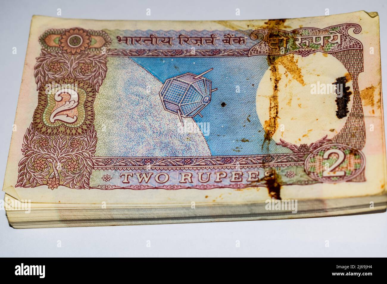 Old Two Rupee notes combined on the table, India money on the rotating ...