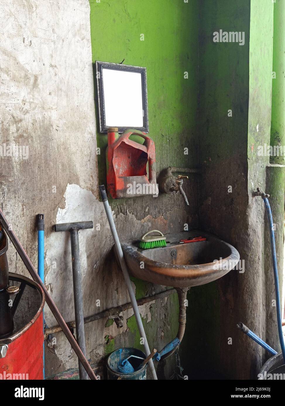 the hand washing station in one of the rooms in a very dirty workshop ...