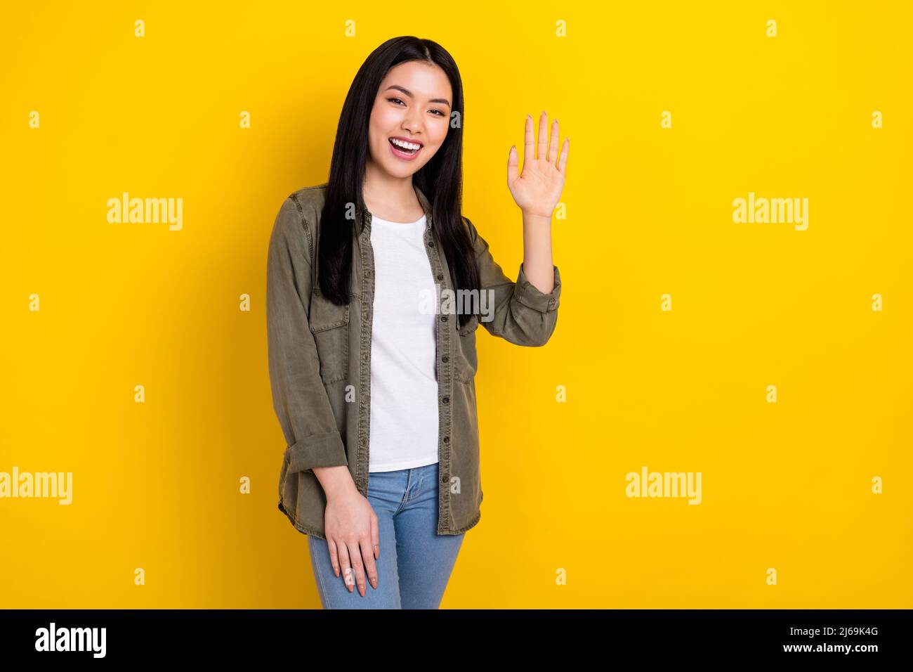 Photo of cheerful stunning young lady enjoy summer weekend wave hand ...
