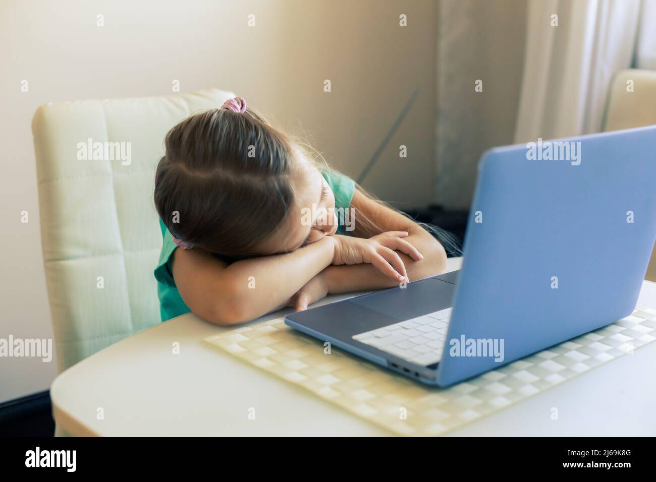 Little cute girl uses laptop to have video call Stock Photo - Alamy