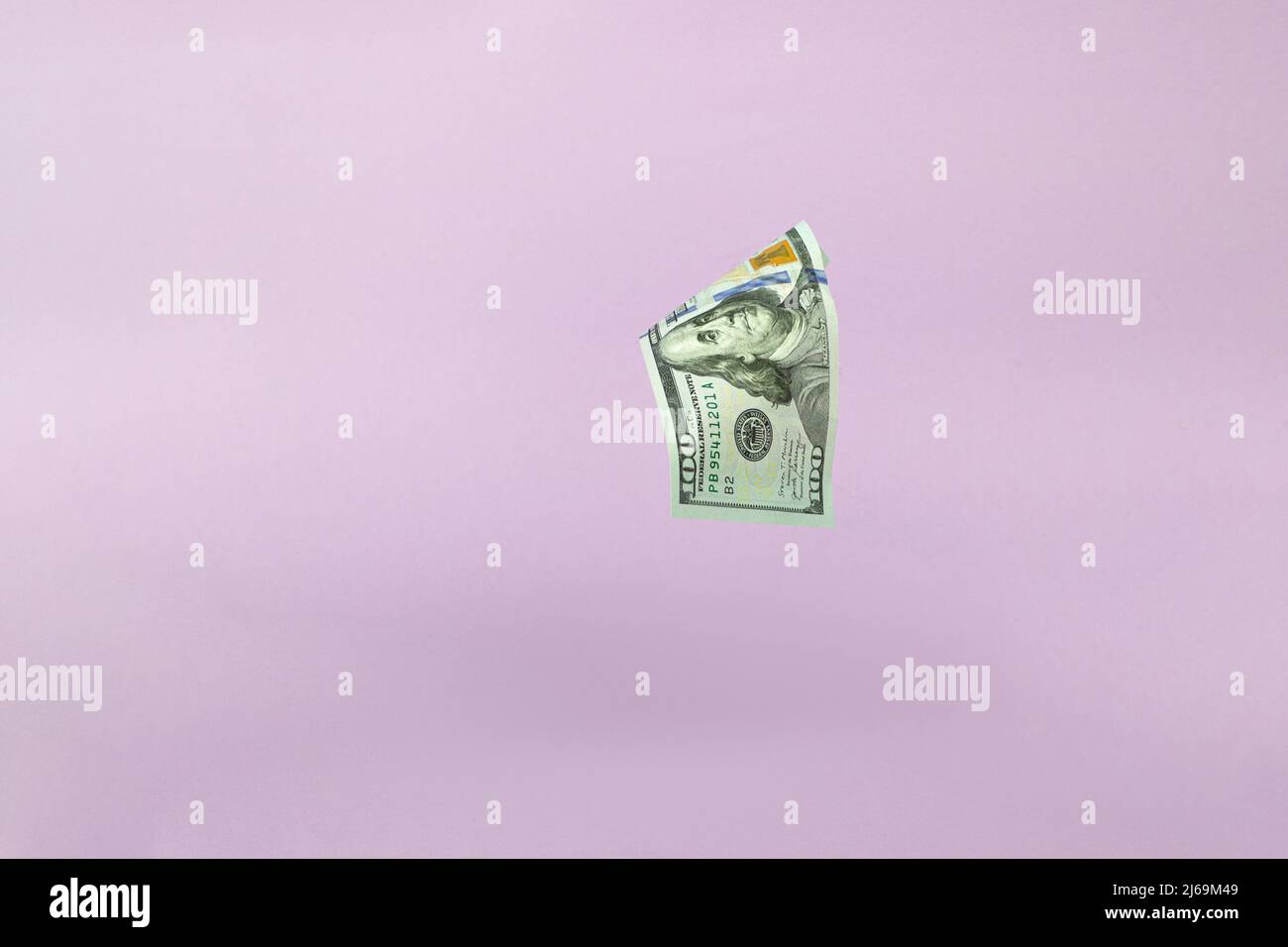 Hundred dollar bill. Falling money on pink background. American cash ...