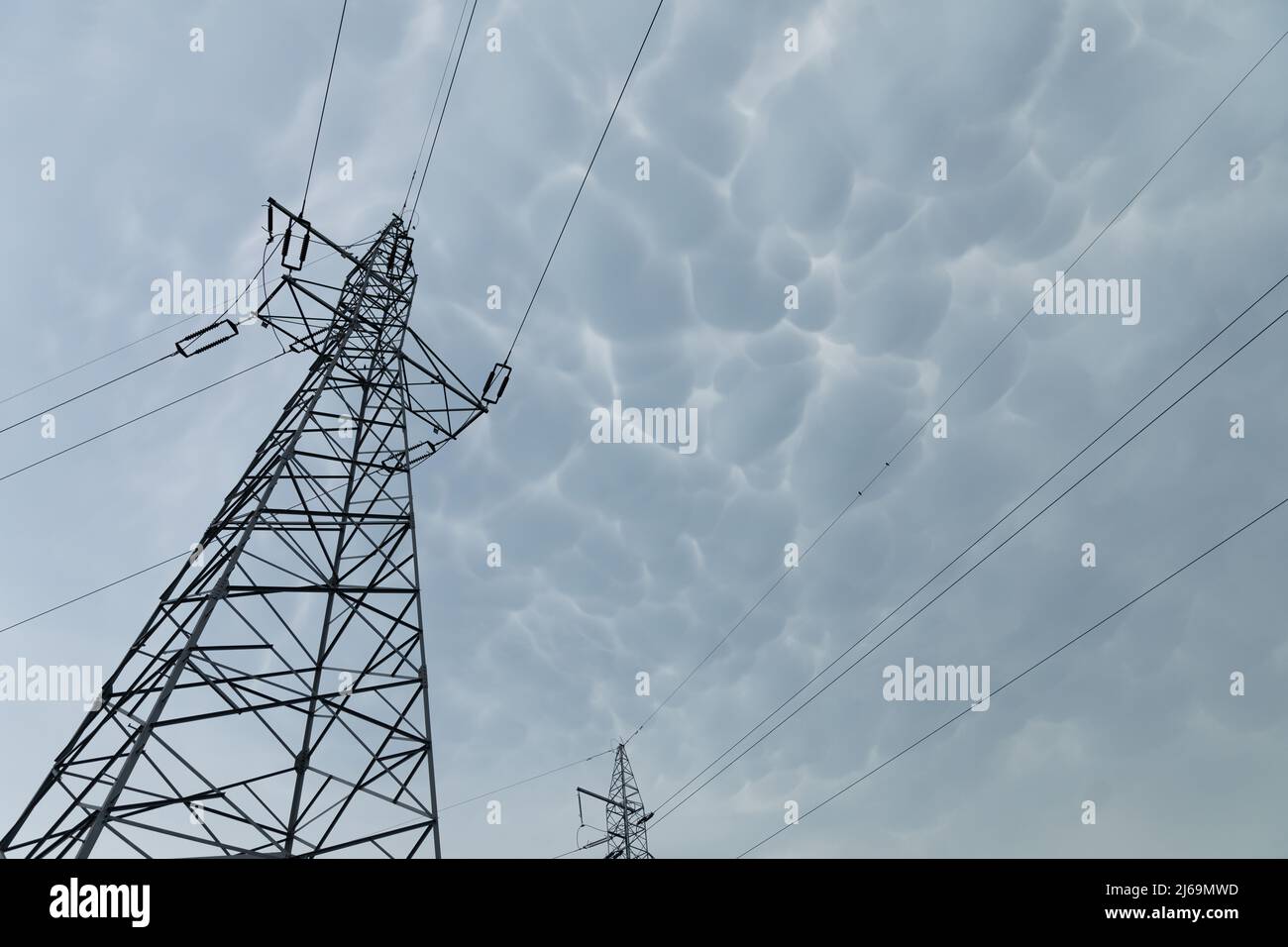 Pole for overhead transmission of eclectic power against a background ...