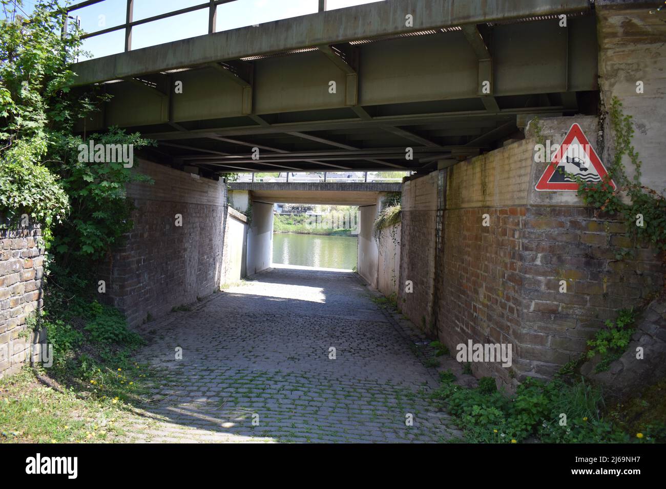 way under main road and railway with flood gates Stock Photo - Alamy