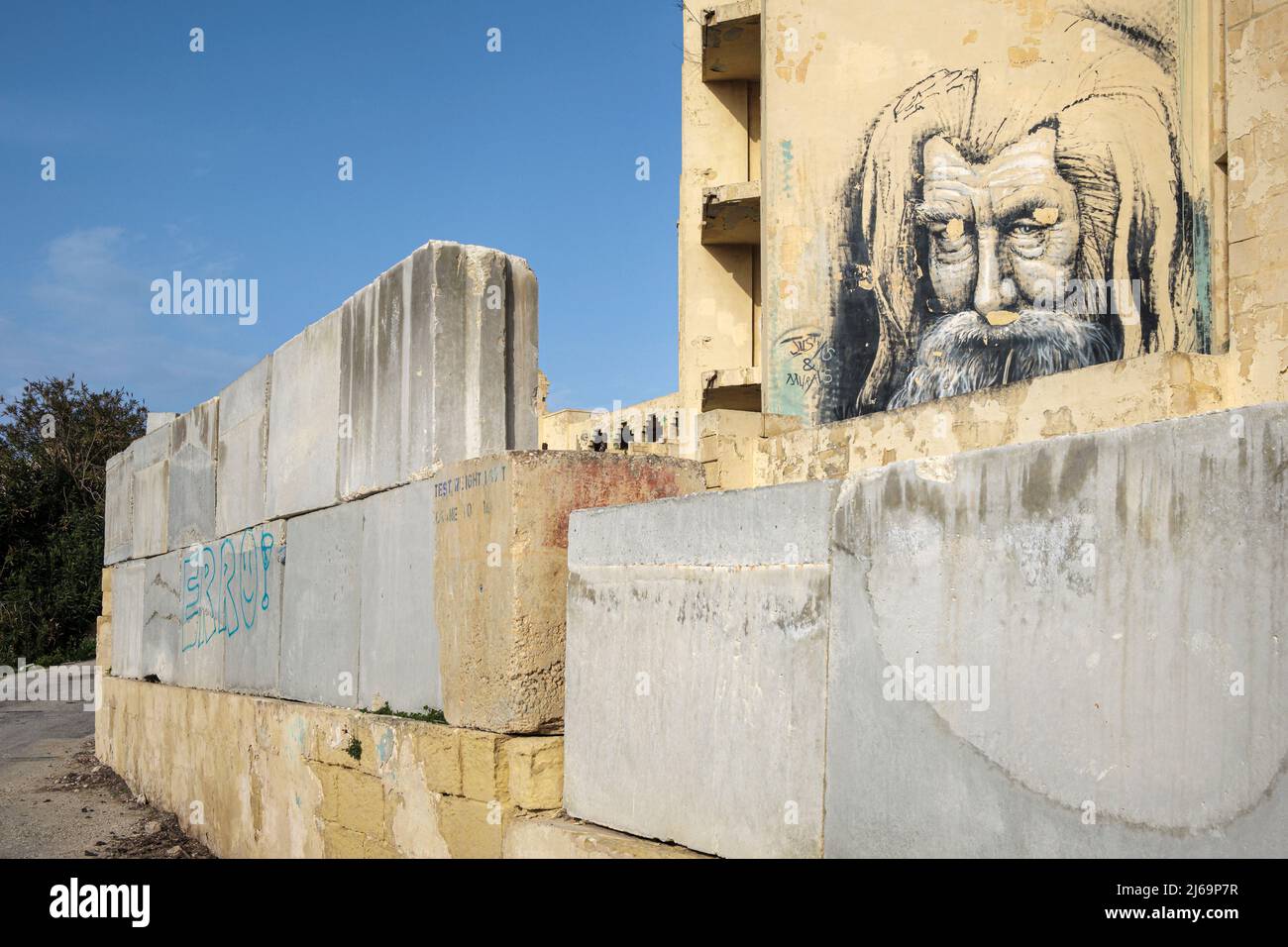 Mural of a bearded man on a wall of the abandoned Jerma Palace Hotel ...
