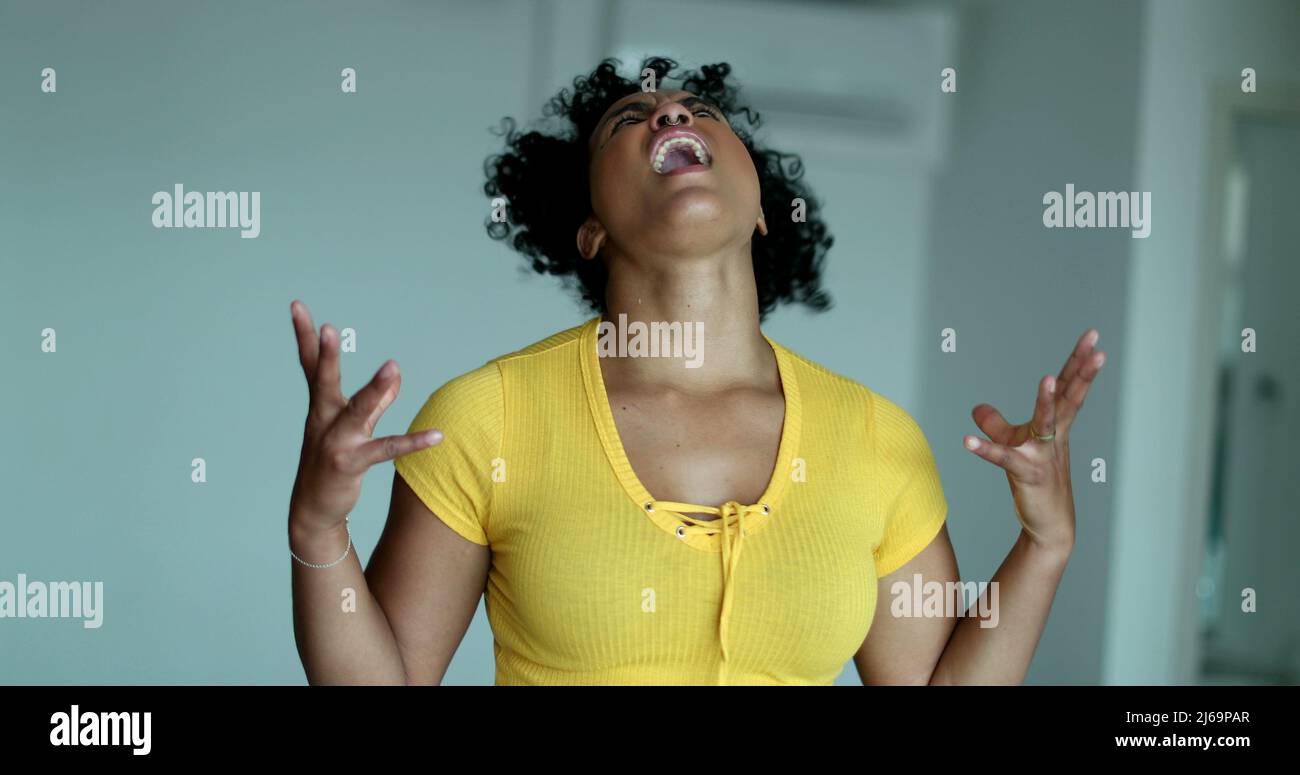 Upset black woman yelling to sky. Angry African American person ...