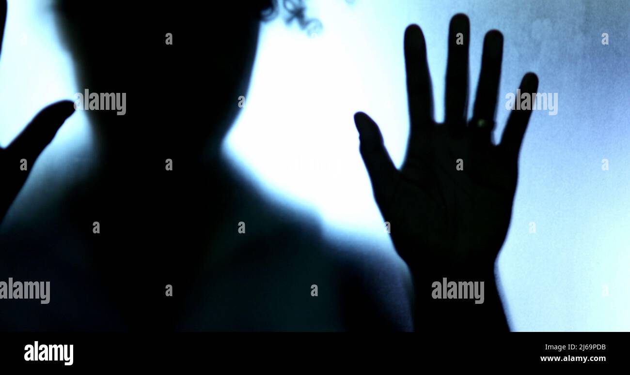 Woman feeling trapped behind glass hi-res stock photography and images ...
