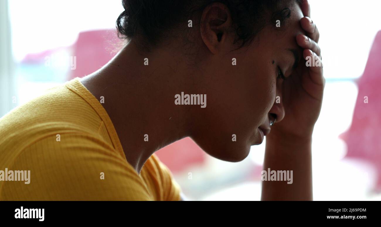 Worried young black woman, concerned African American girl Stock Photo ...