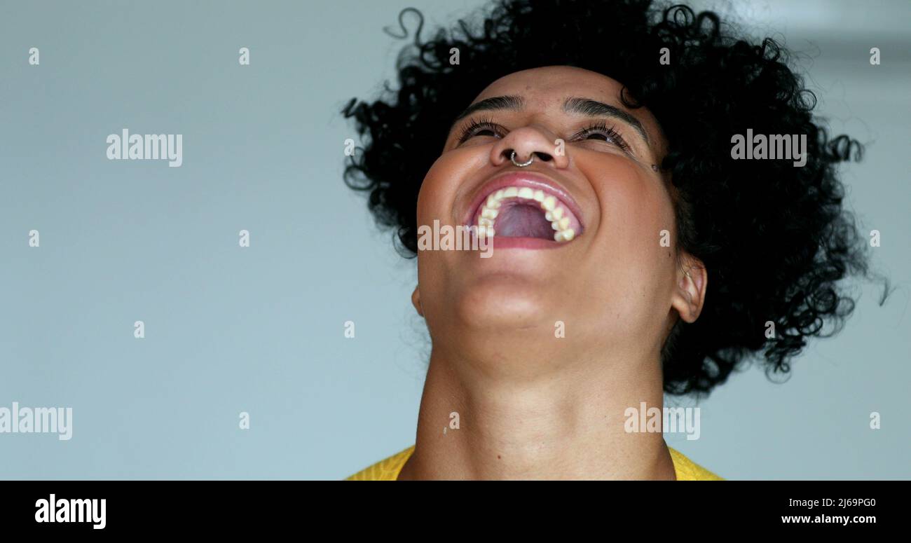 Young woman bursting out laughing hi-res stock photography and images - Alamy