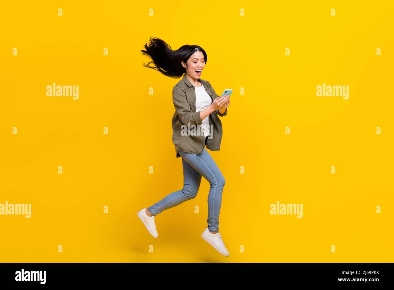 Full length photo of brunette hair lady read device news discount jump ...