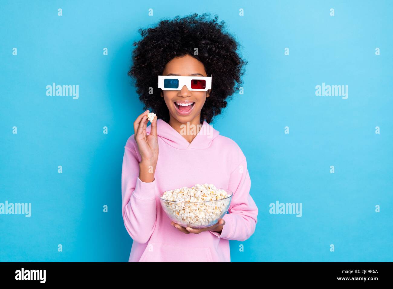 Photo of young excited girl eat popcorn free-time watch television ...