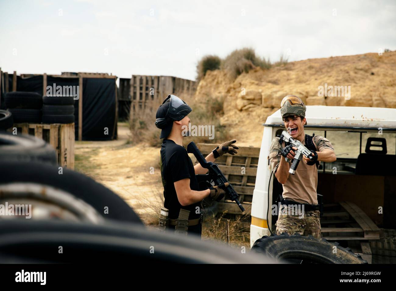 Teammates having fun in an airsoft game Stock Photo - Alamy