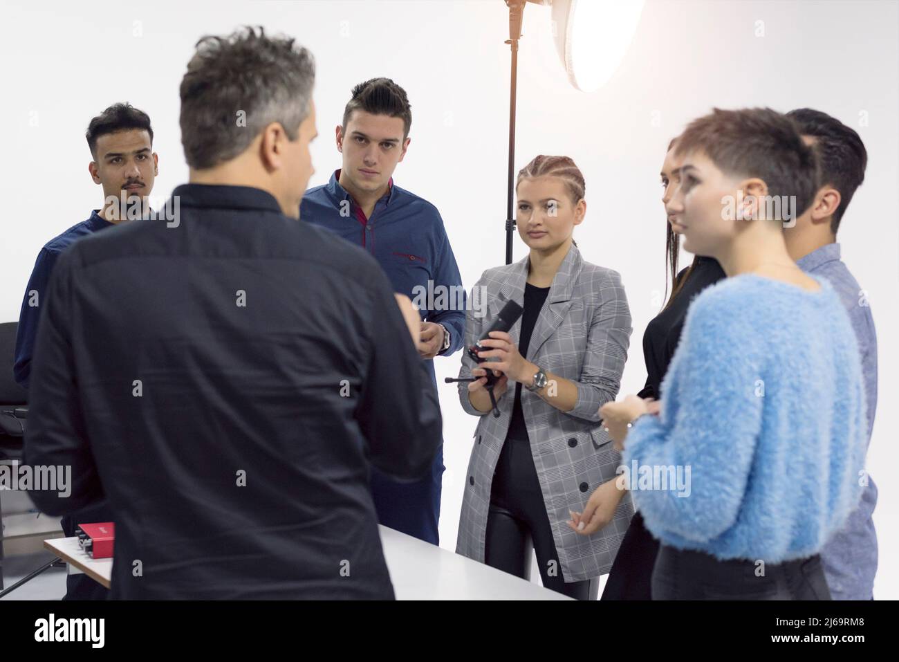 Students with video camera in computer lab, Filming in a Studio ...