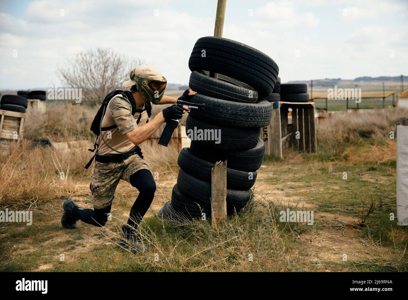 Soldier carefully advancing position in the middle of an airsoft game ...