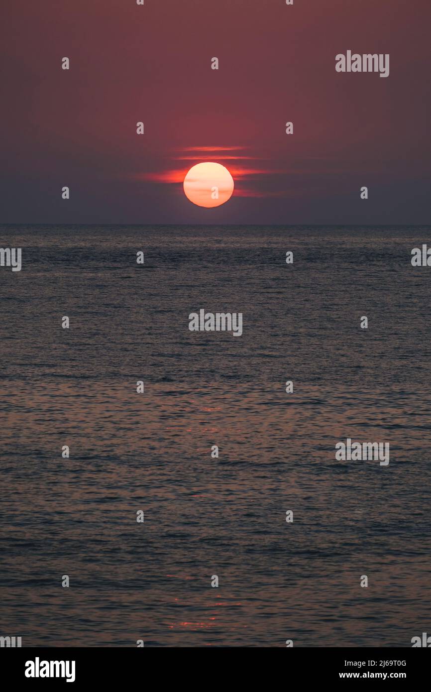 Sun fading in the horizon before sunset, Petani beach, Kefalonia Stock ...