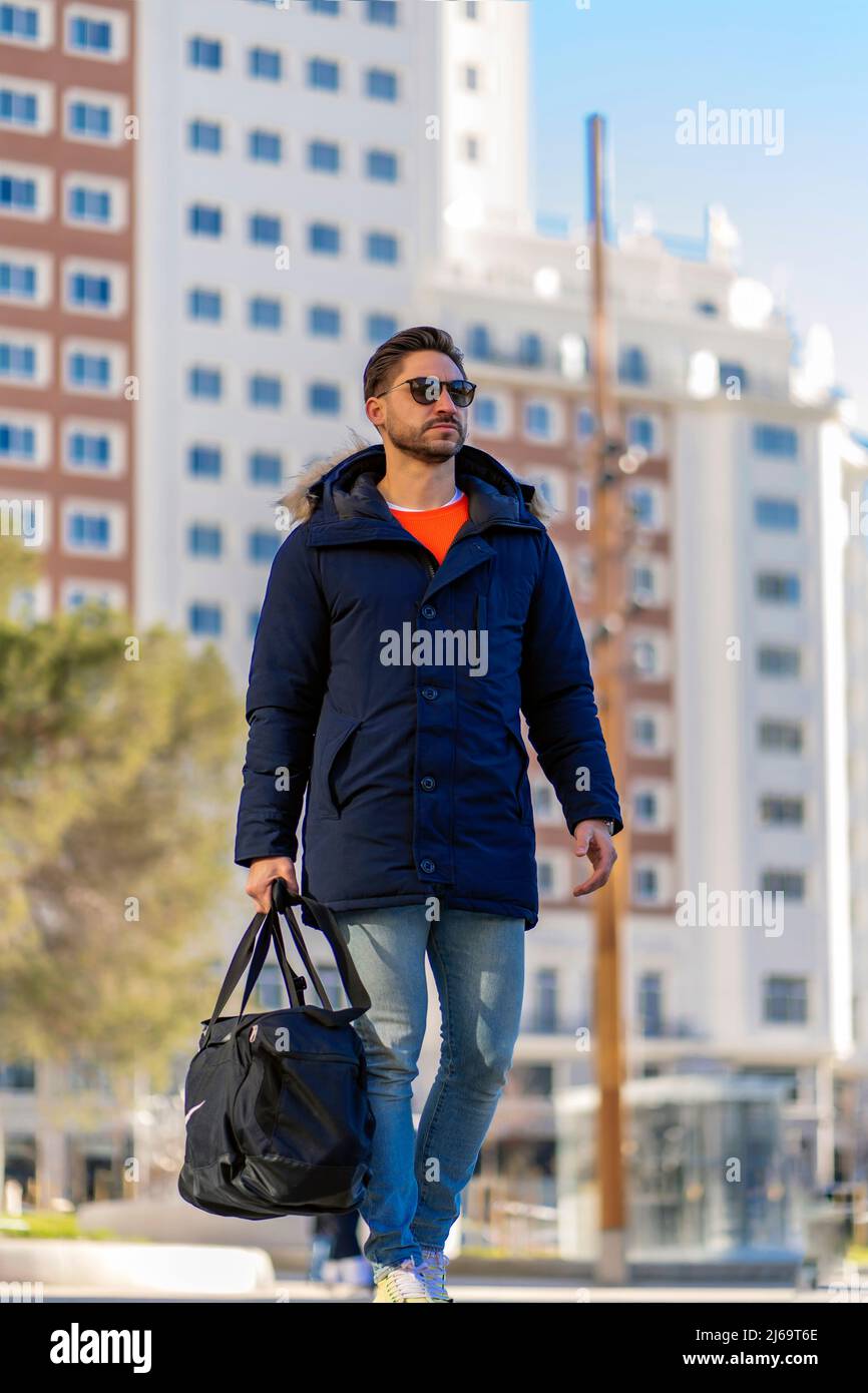 Boy walking around town hi-res stock photography and images - Alamy