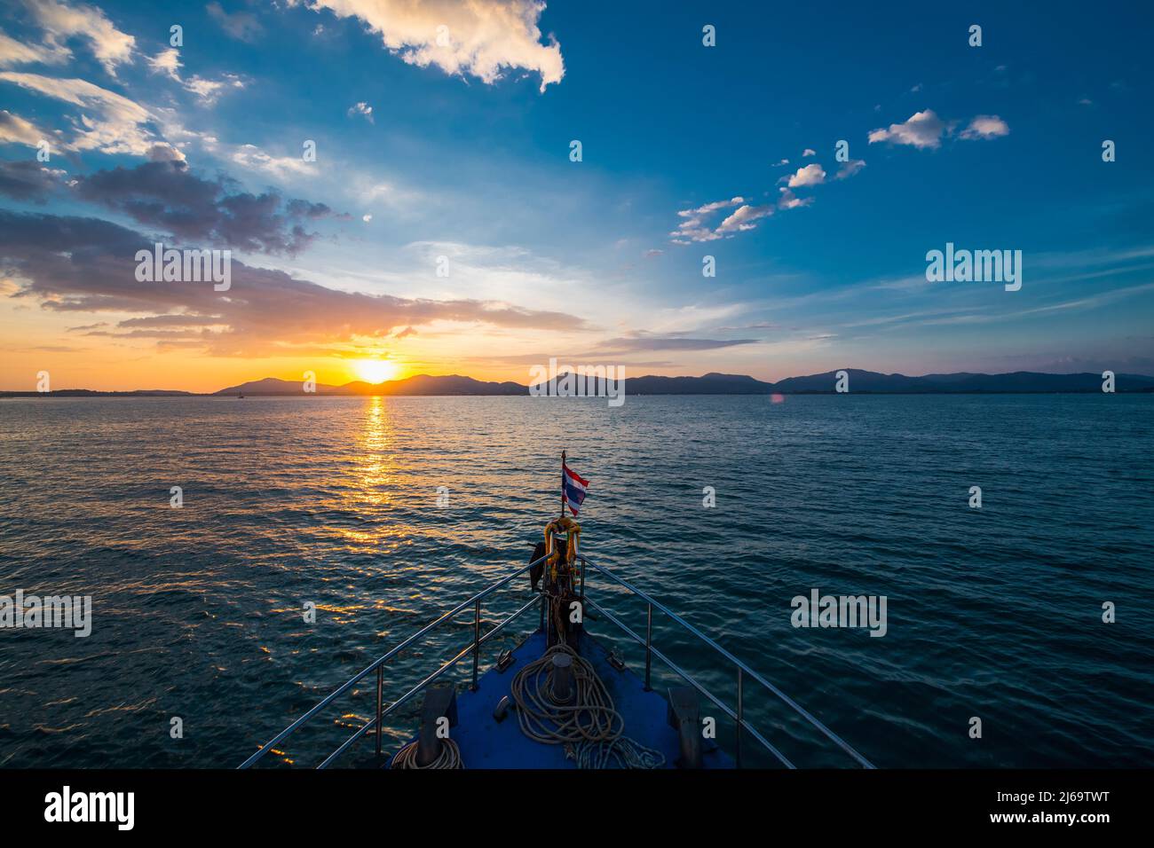 bow of a diving vessel heading into the sunset in Phuket Stock Photo ...
