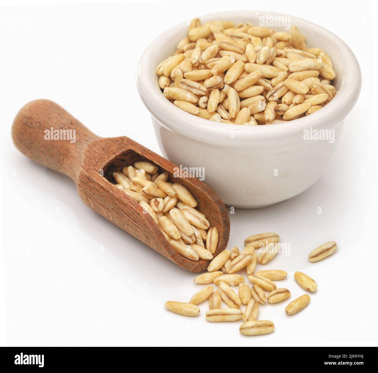 Whole oats closeup over white background Stock Photo - Alamy