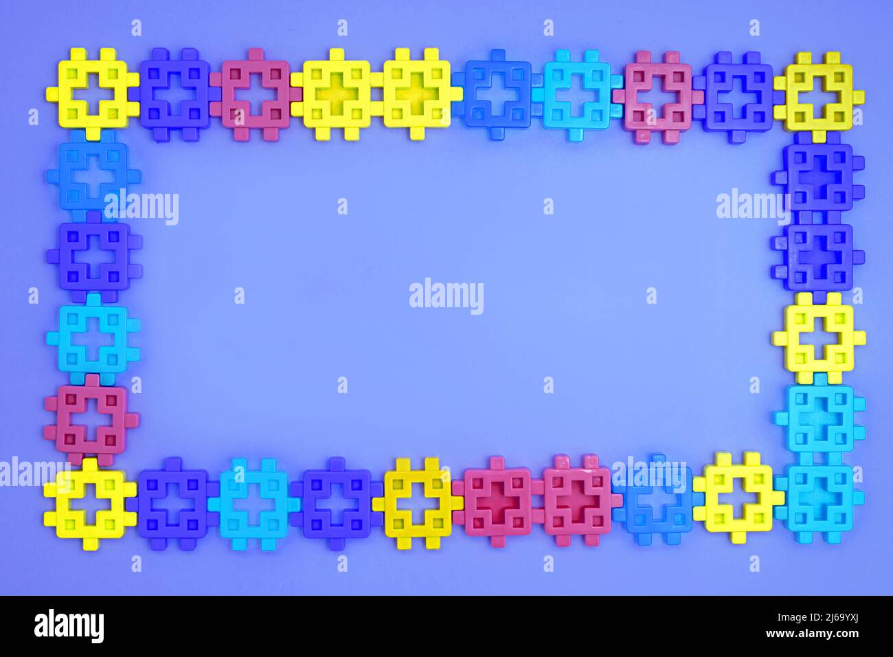 Colorful kids toys frame on blue background Stock Photo - Alamy