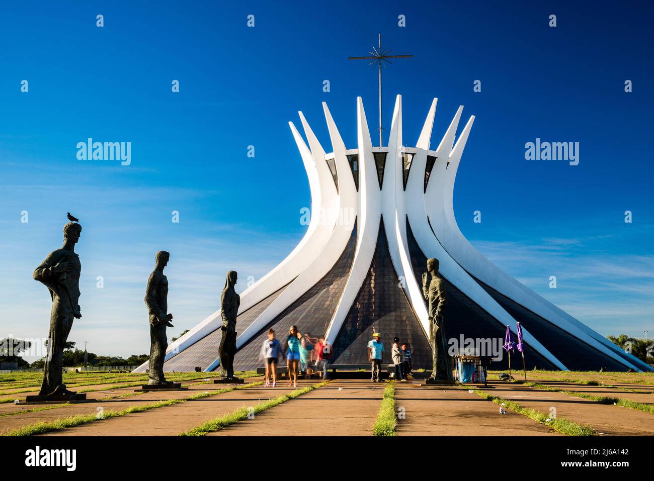 The metropolitan cathedral of brasilia at dusk with its statues and ...