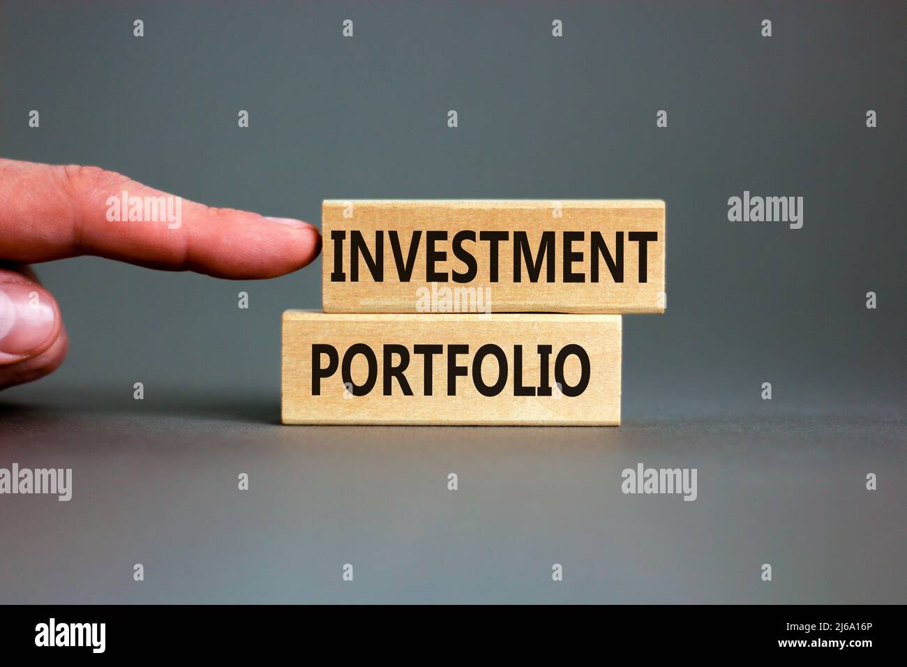 Investment portfolio symbol. Wooden blocks with concept words ...