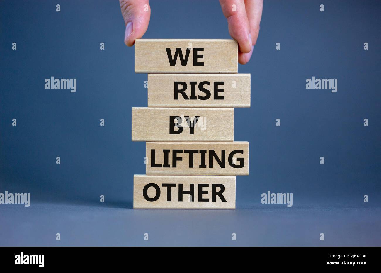 We rise by lifting other symbol. Concept words We rise by lifting other ...