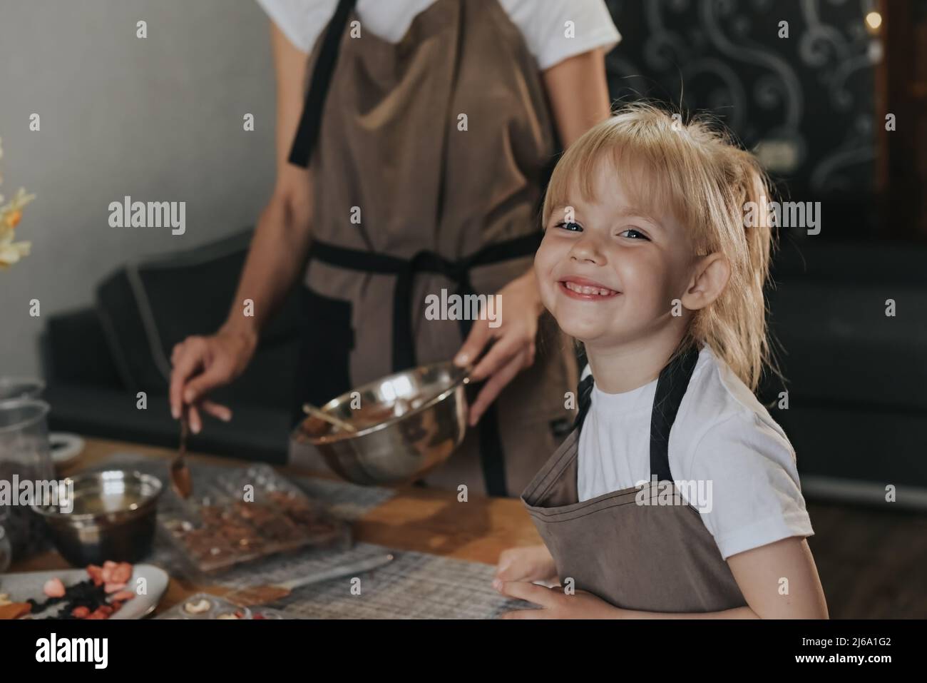 Mom and daughter make chocolate at home Stock Photo - Alamy