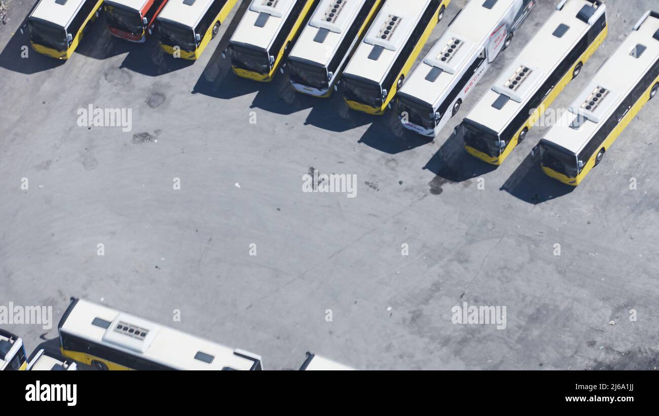 Aerial Birds Eye View Shot Of Bus Station Lined Up And Filled With ...