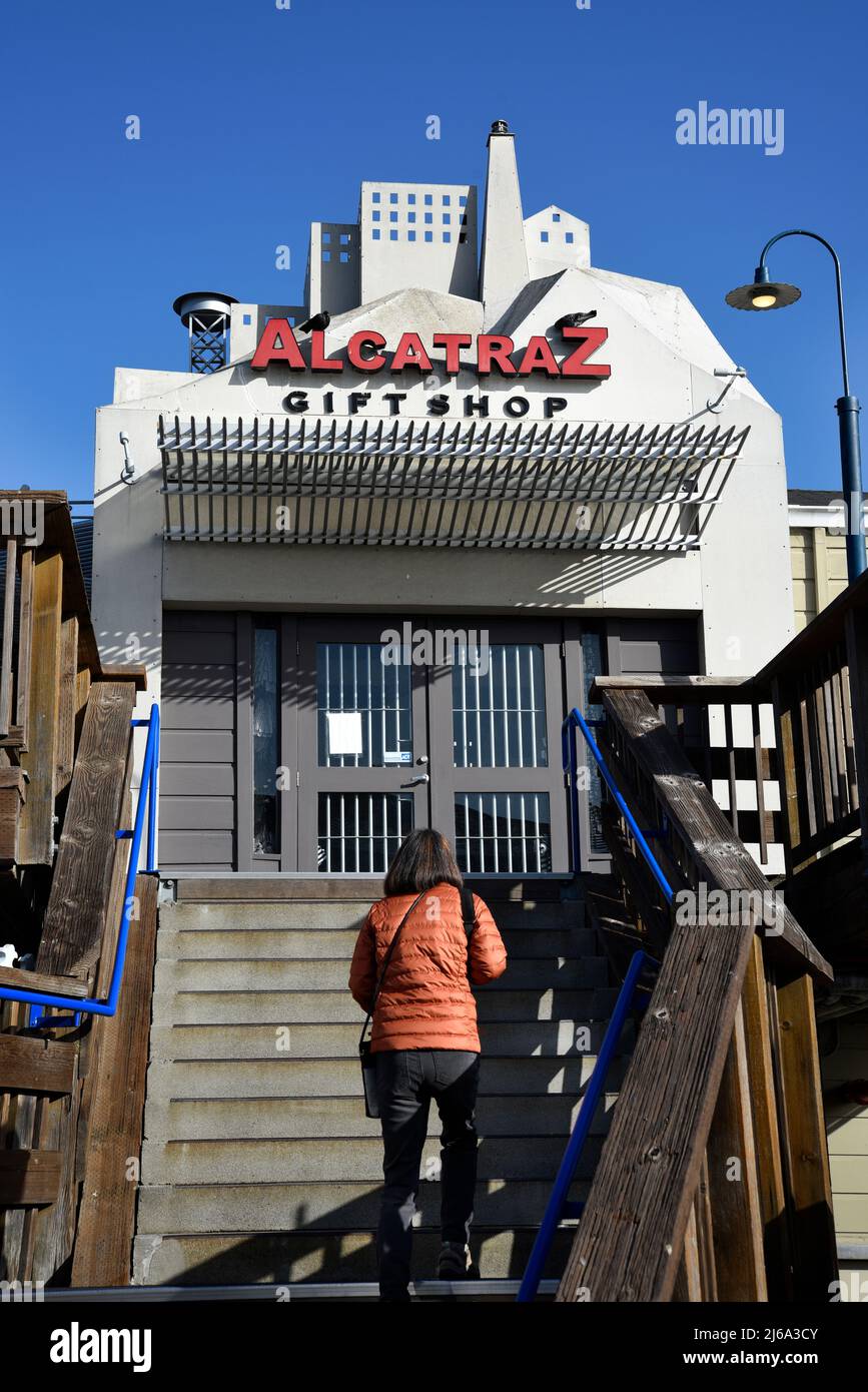 A tourist enters the Alcatraz Gift Shop at Pier 39, a popular shopping ...