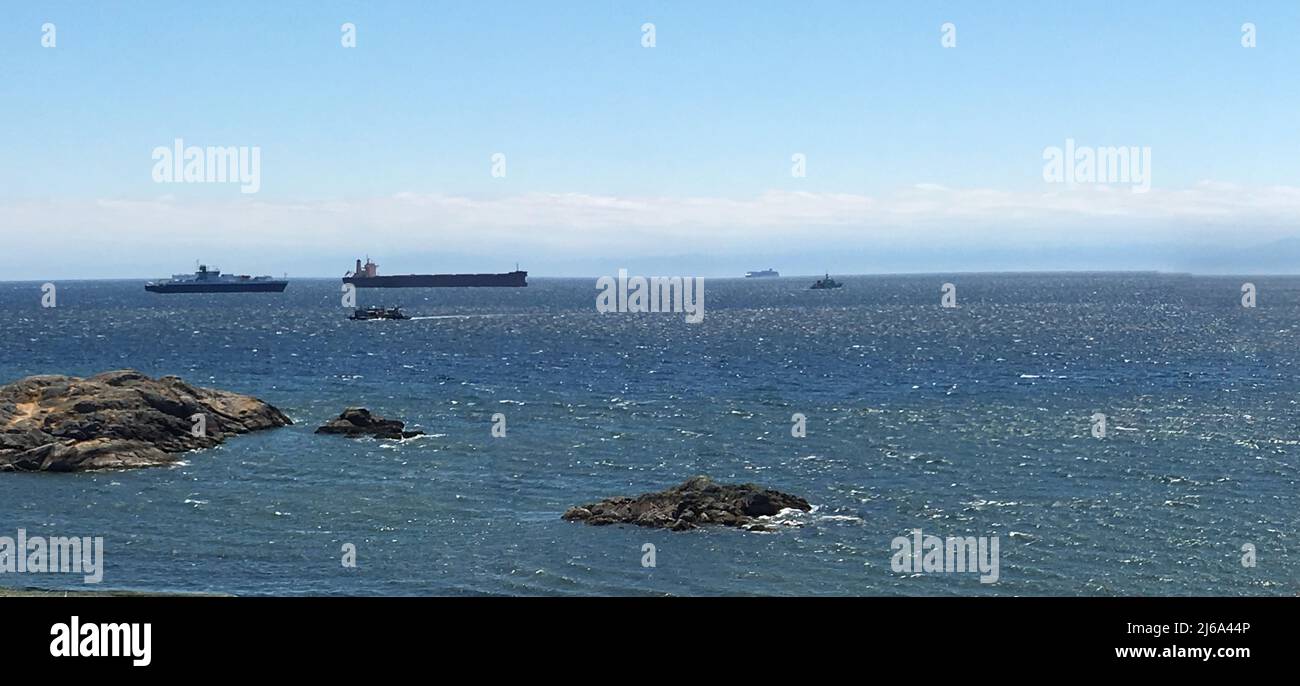 Panorama view of an ocean with naval ships at Victoria Island, BC ...