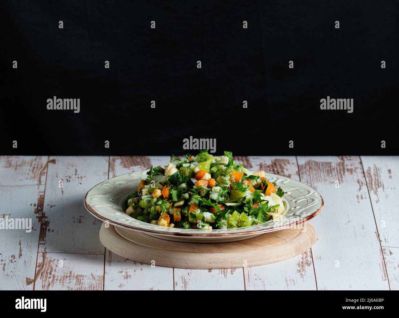 Green salad with potatoes, peppers, carrots, dill, parsley, apple ...