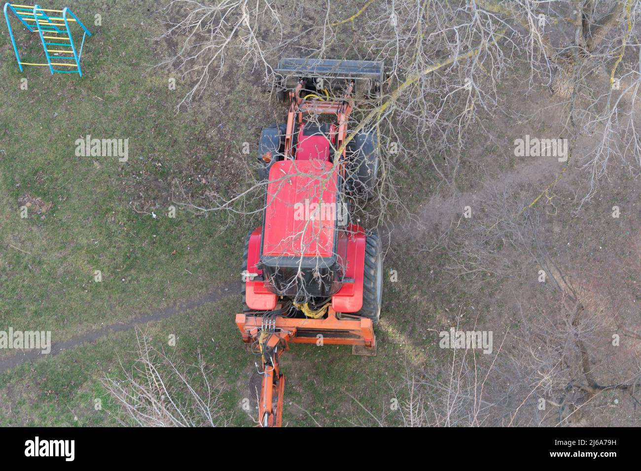 Excavator Tractor digs a hole, top view. The tractor is digging a hole ...