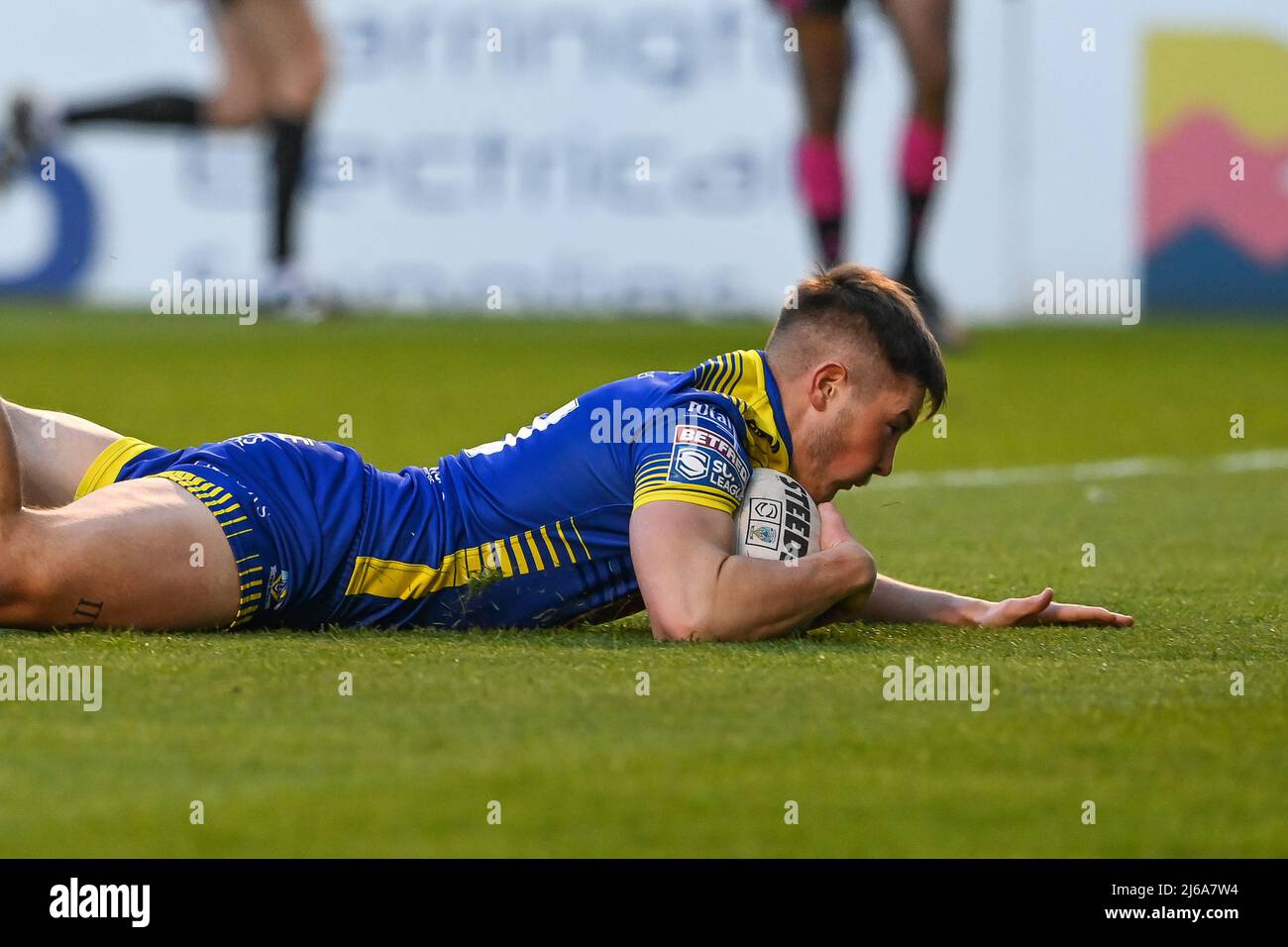 Riley Dean #27 of Warrington Wolves goes over for a try Stock Photo - Alamy