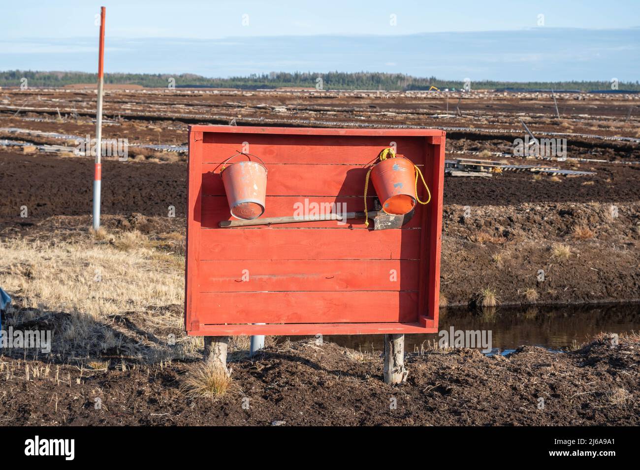 Wall-mounted fire shield with fire-fighting tools. Shovel, hook , axe ...