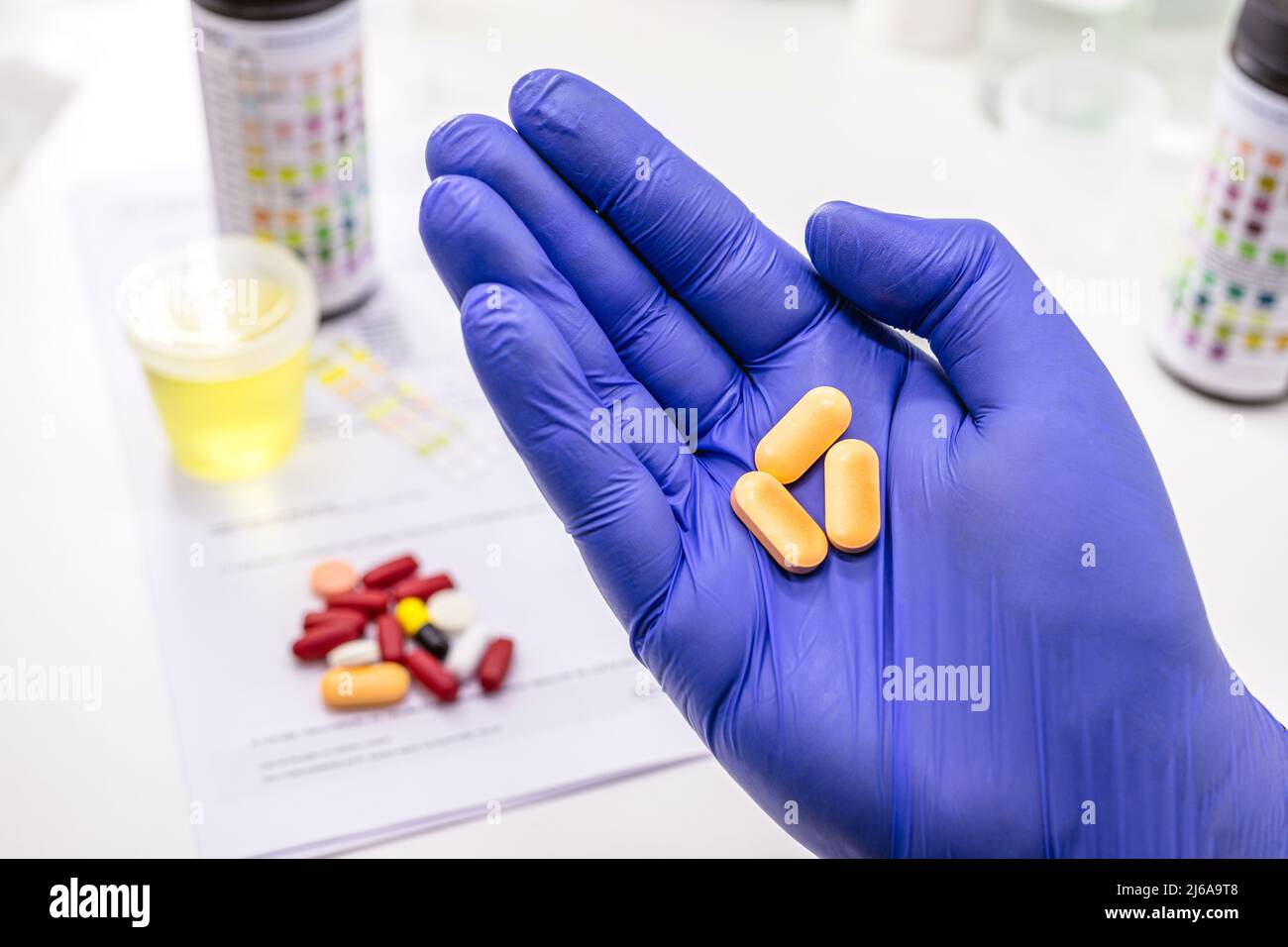 pharmacist hand holding tablet for diabetes control,arterial ...