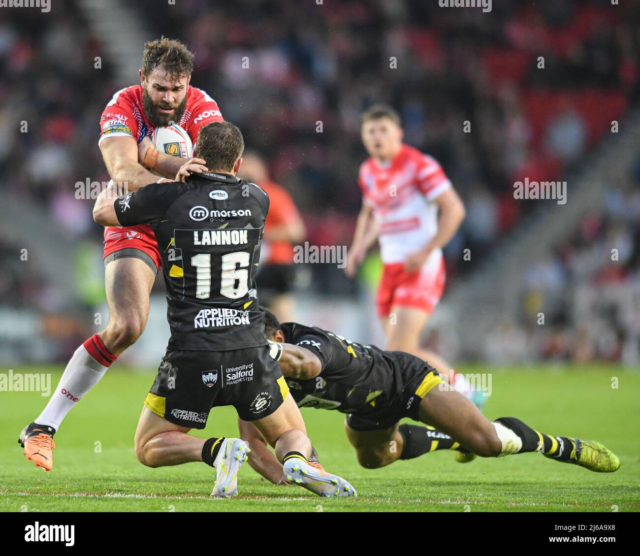 Alex Walmsley #8 of St Helens looks for a way past Ryan Lannon #16 of ...
