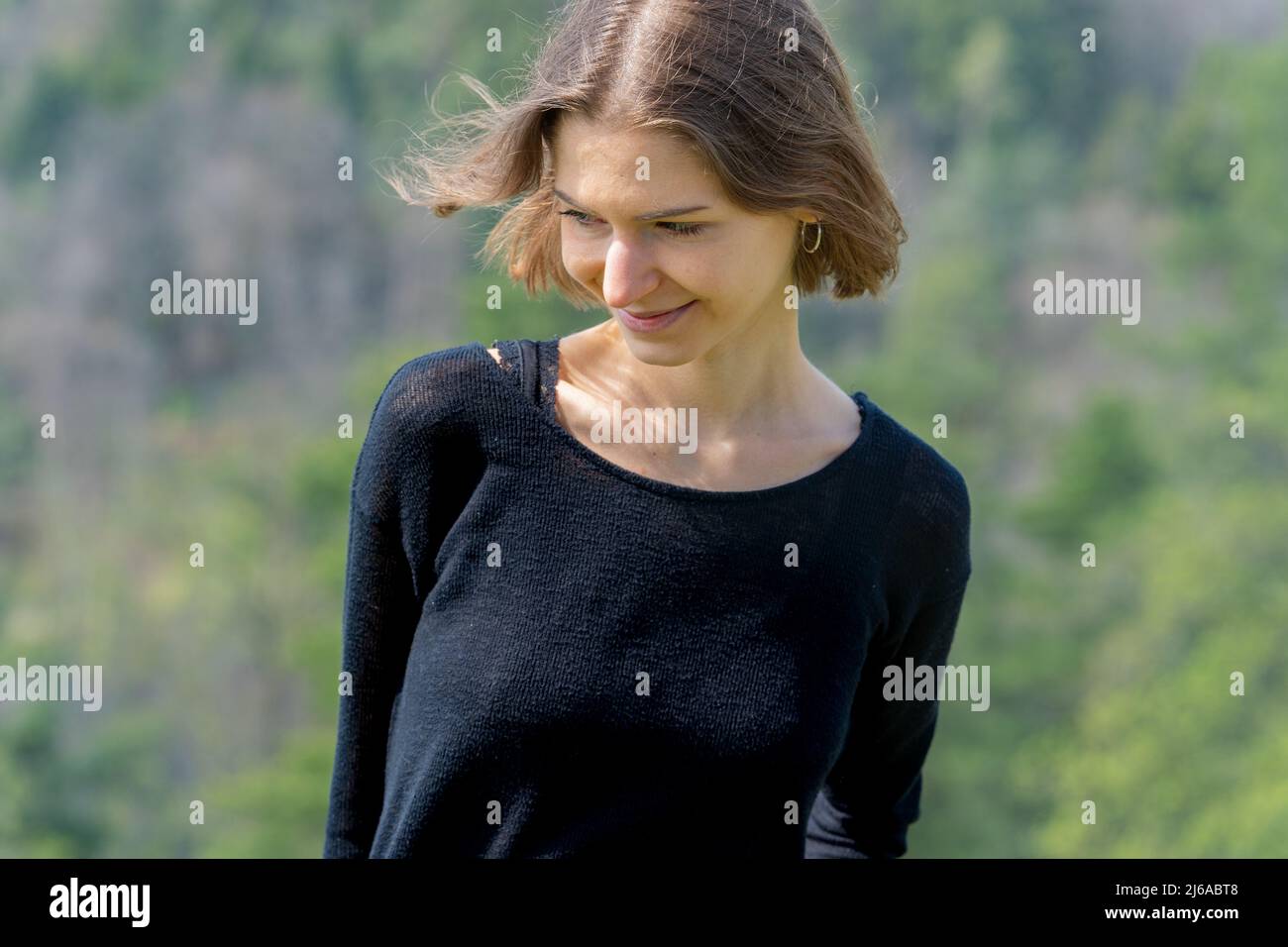 Beautiful woman looking down hi-res stock photography and images - Alamy
