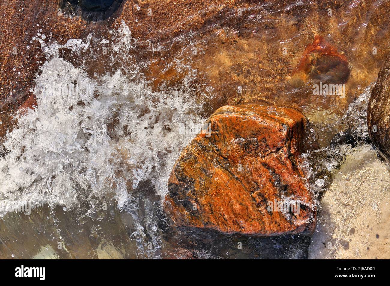 Directly Above Shot of Small Waves Rolling into Beach Dotted with ...