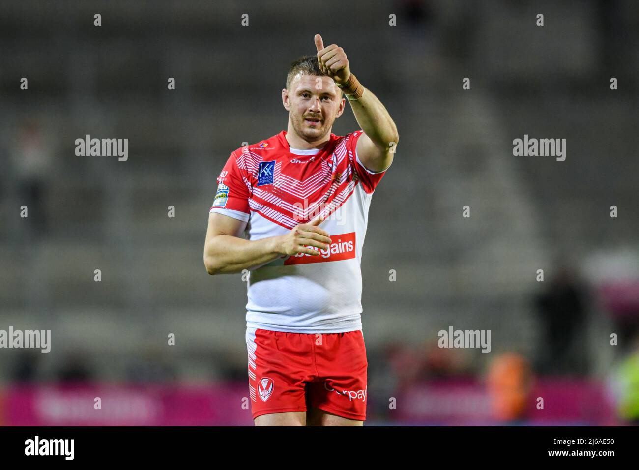 Joe Batchelor #12 of St Helens gives a thumbs up to the home supporters ...