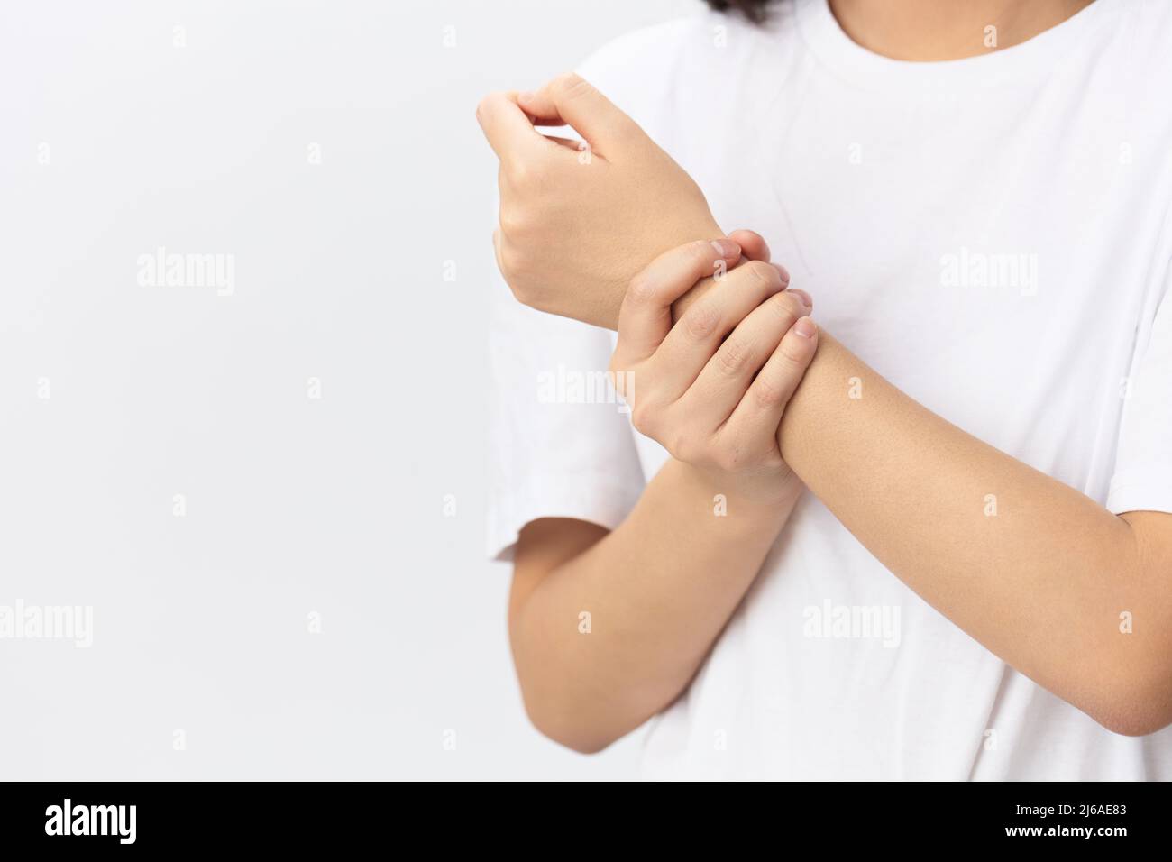 Broken hand Cramp. Closeup shot of suffering beautiful young Asian ...