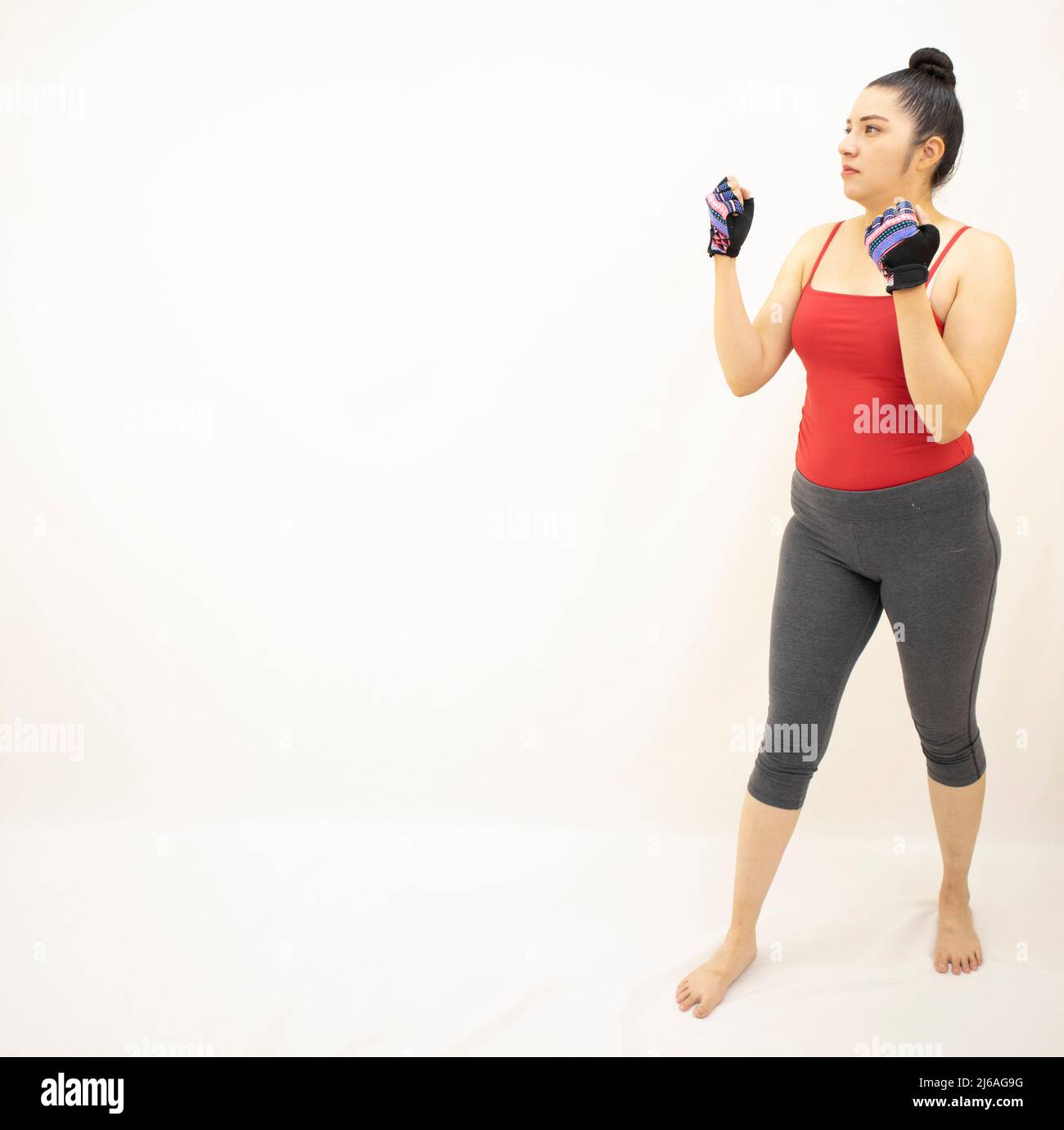 beautiful athletic asian woman in gray sportswear red top, practicing ...