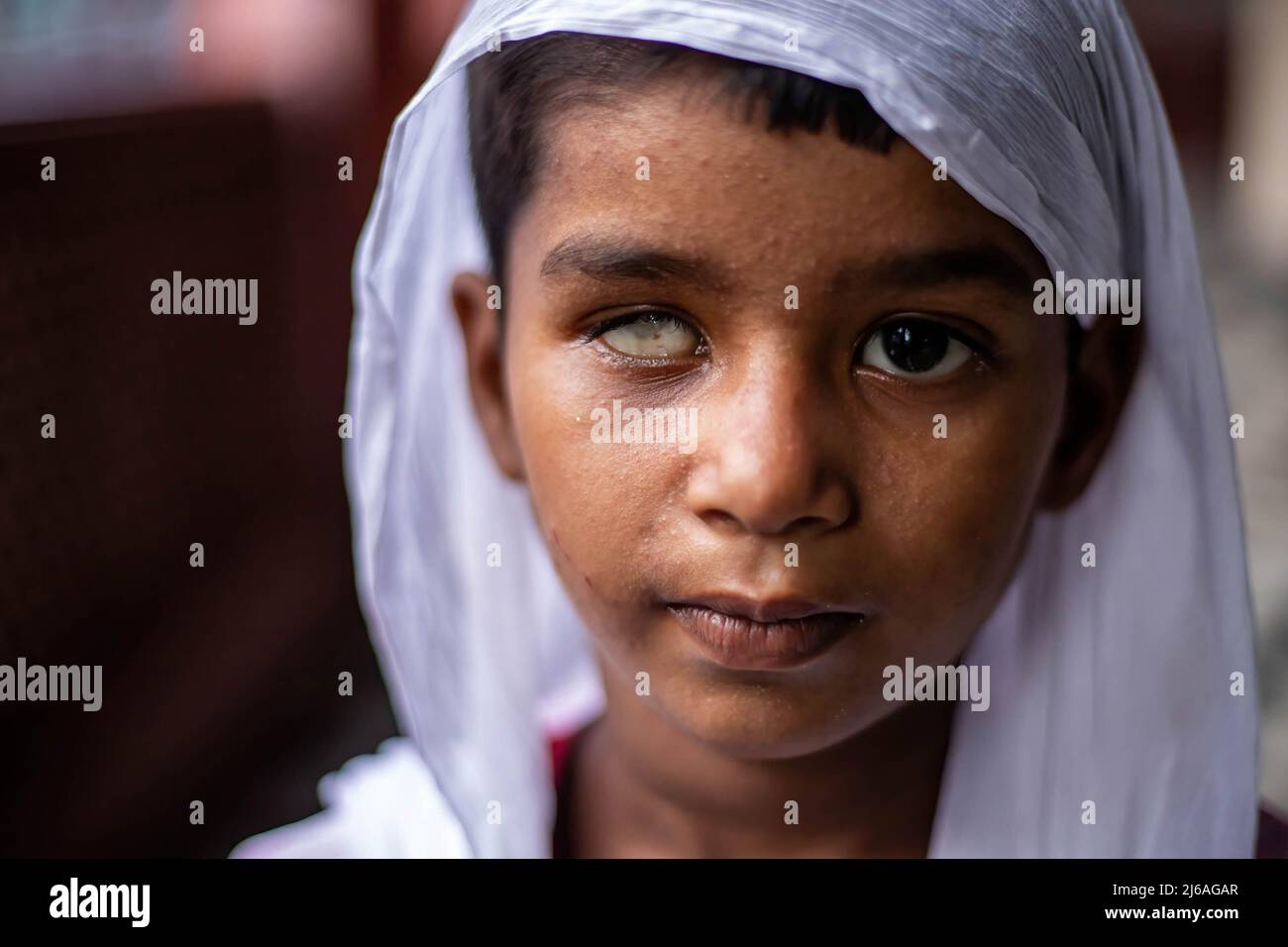 A visually impaired Muslim girl poses for a picture in a mosque after ...