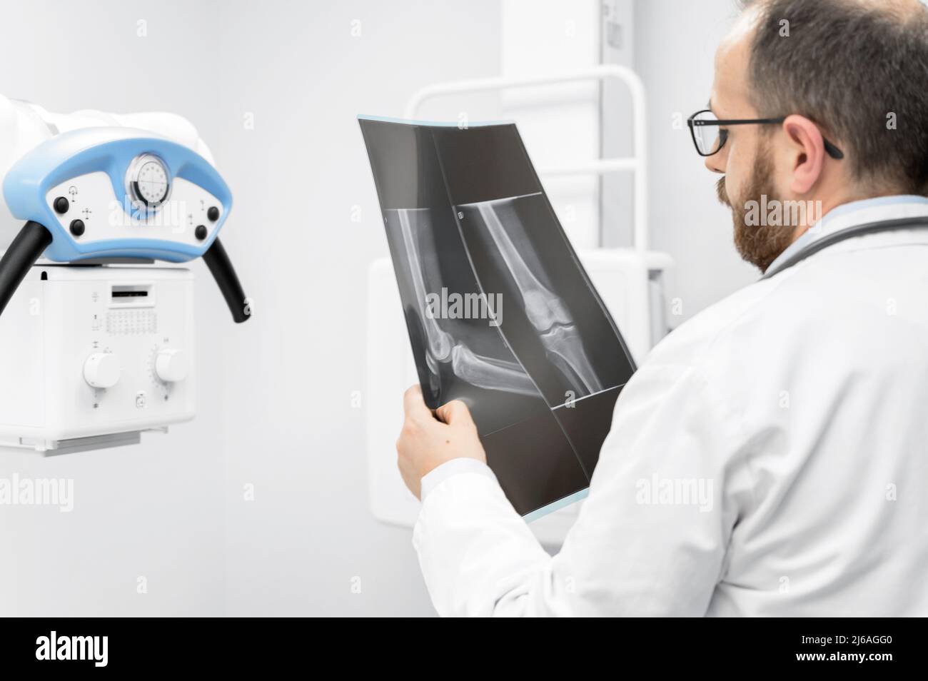 Doctor examining radiology pointing hi-res stock photography and images ...