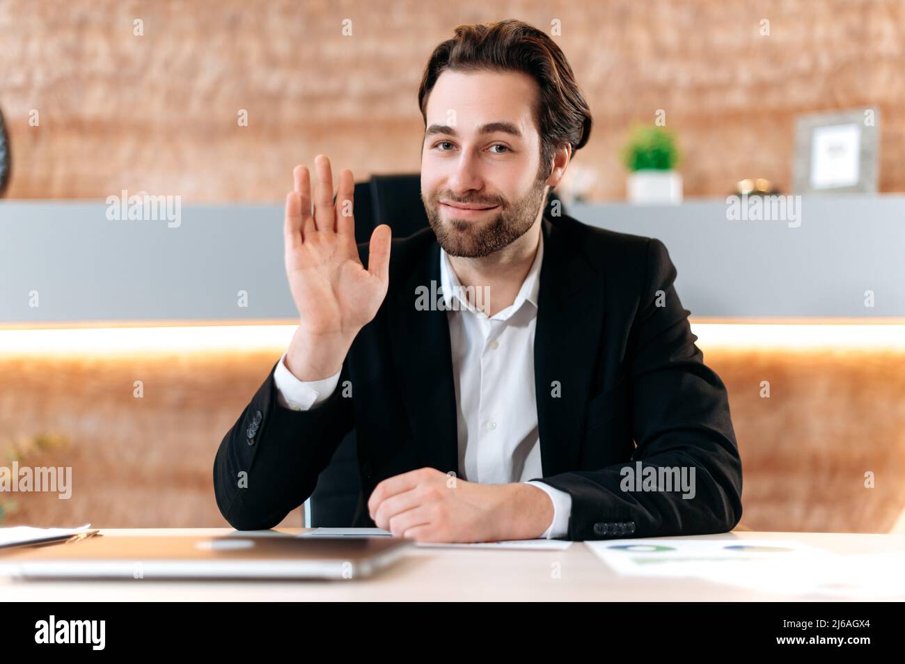 Video man in suit waving hi-res stock photography and images - Alamy