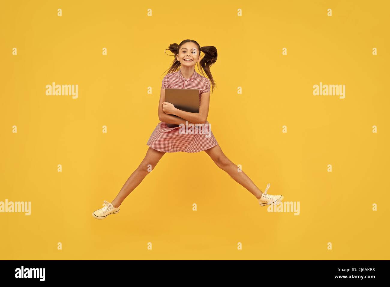 happy kid girl jumping with laptop go online shopping, discount Stock ... happy kid girl jumping with laptop go online shopping, discount Stock ...